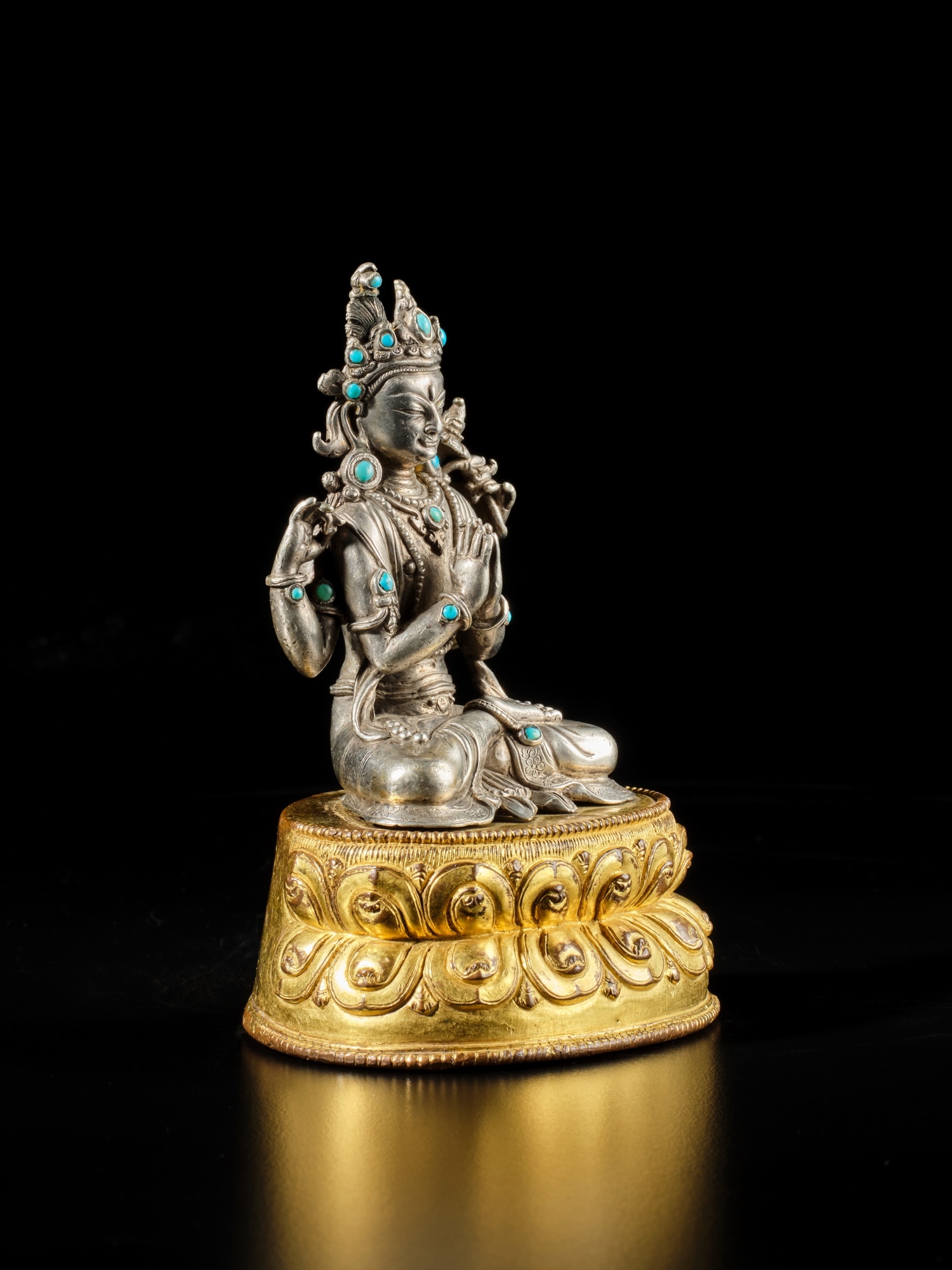 Tibetan School, 15th Century | A silver and gilt copper figure of ...