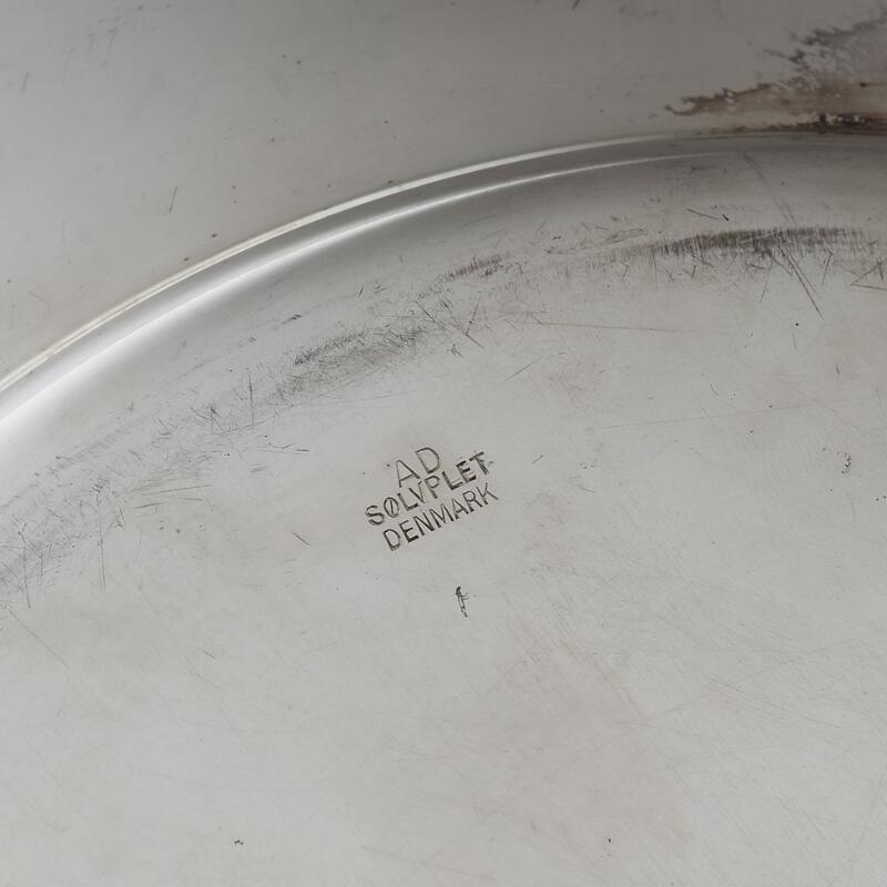 A. Dragsted | A set of eight silver plated place plates decorated with ...