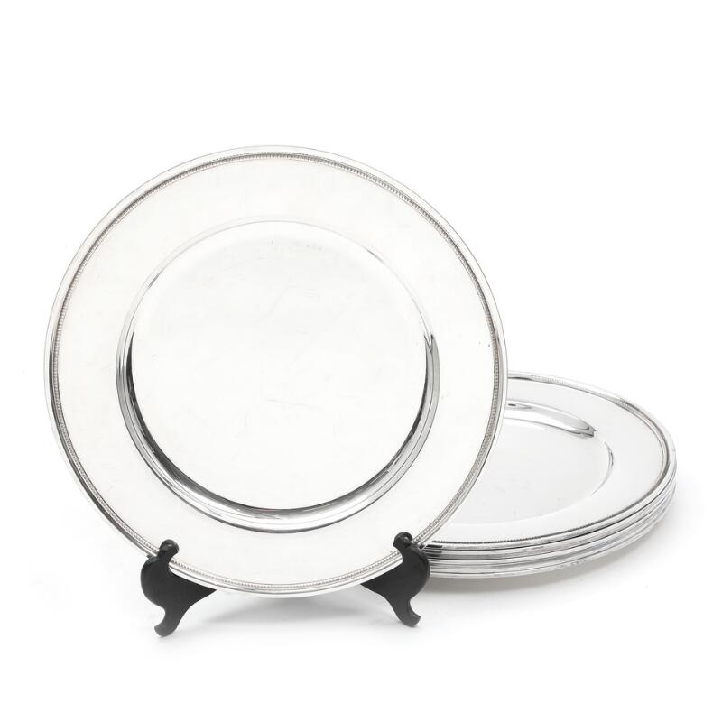 A. Dragsted | A set of eight silver plated place plates decorated with ...