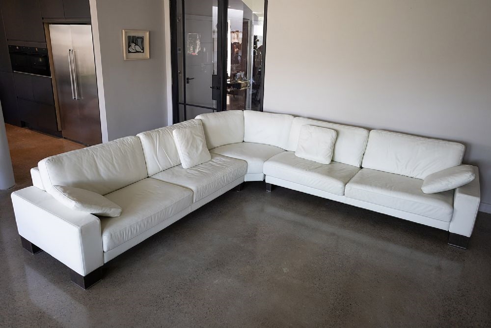 Rolf Benz | A WHITE LEATHER L-SHAPE SOFA | MutualArt