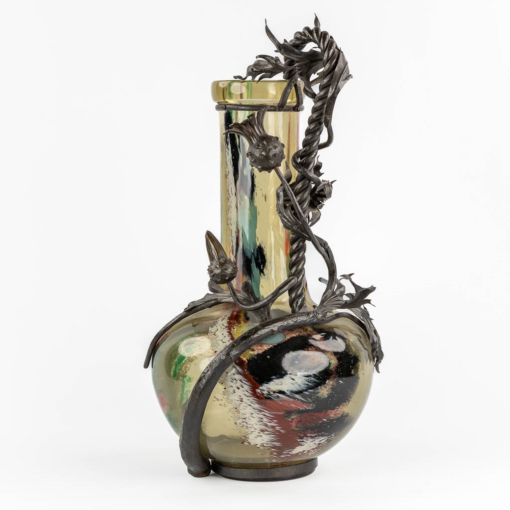 Lode van Boeckel | A glass vase mounted with sculptural cast iron, in ...