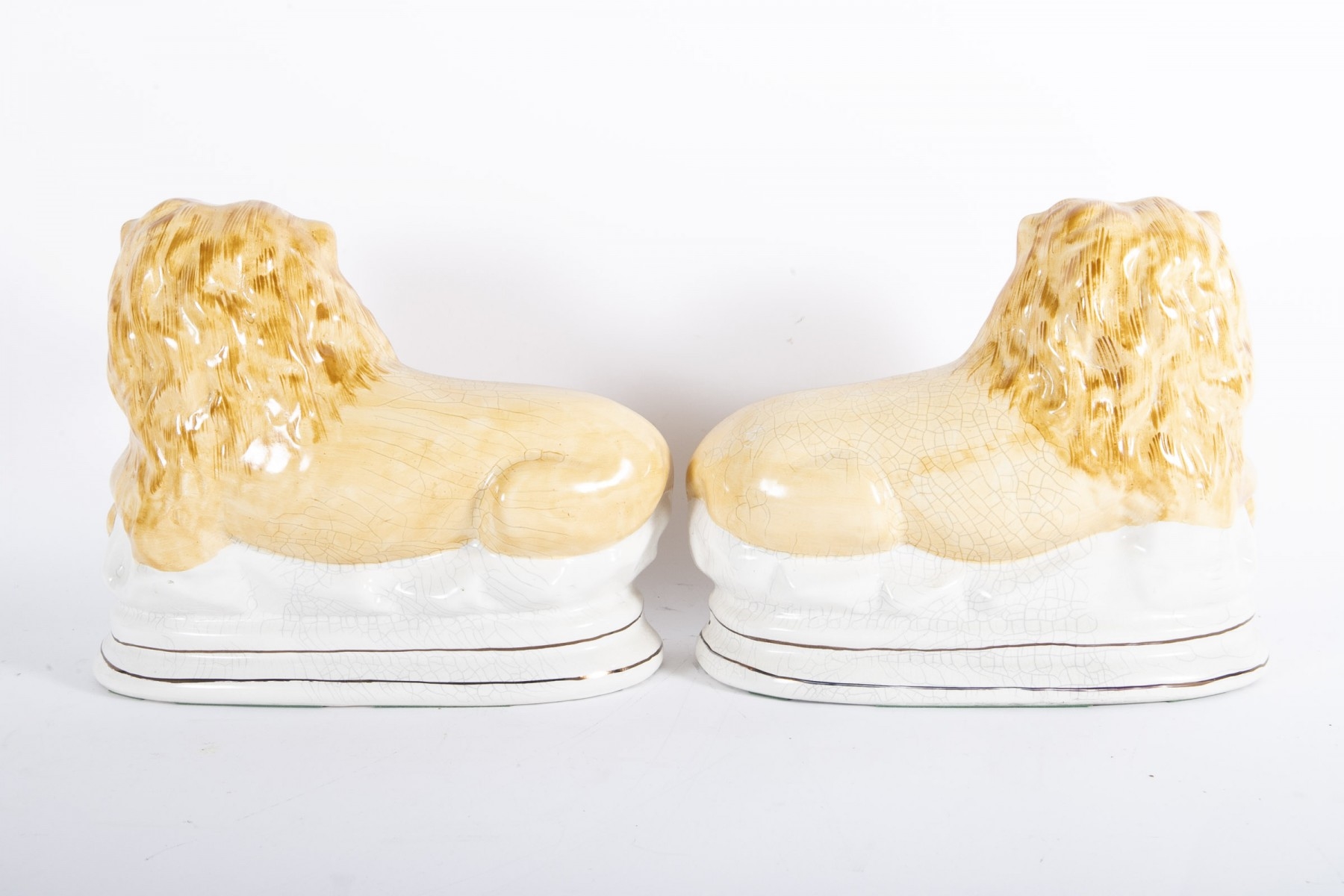 Staffordshire | Staffordshire Ceramic Reclining Lion Figures | MutualArt
