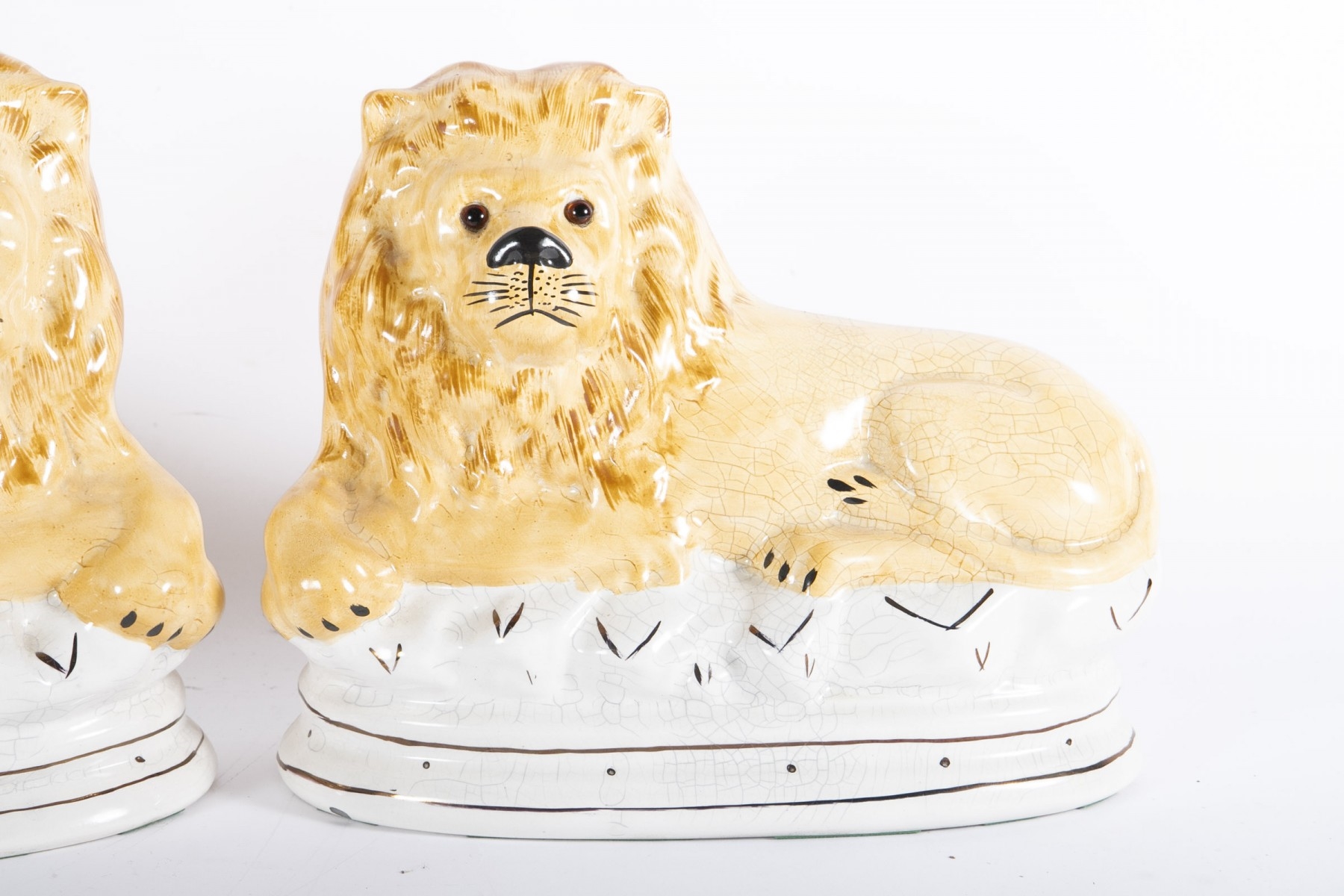 Staffordshire | Staffordshire Ceramic Reclining Lion Figures | MutualArt