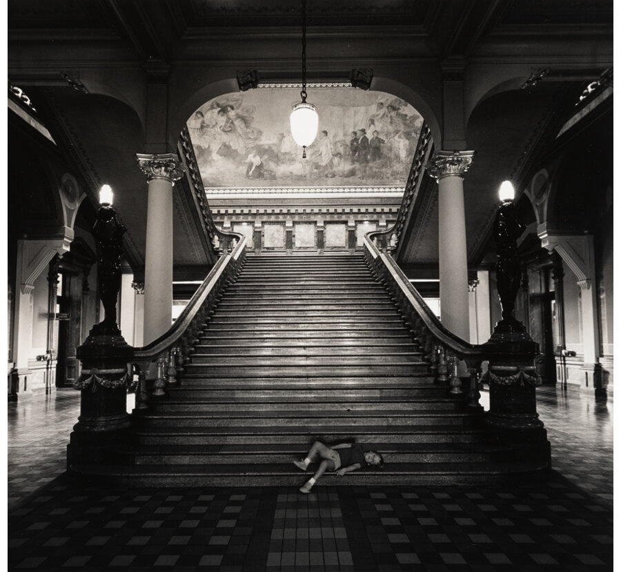 Douglas Prince | Untitled (Boy Laying on Stairs) (Circa 1970) | MutualArt
