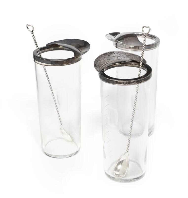 Ole Hagen | Three clear glass cocktail pitchers with sterling silver ...