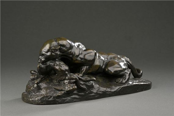 jaguar devouring a hare