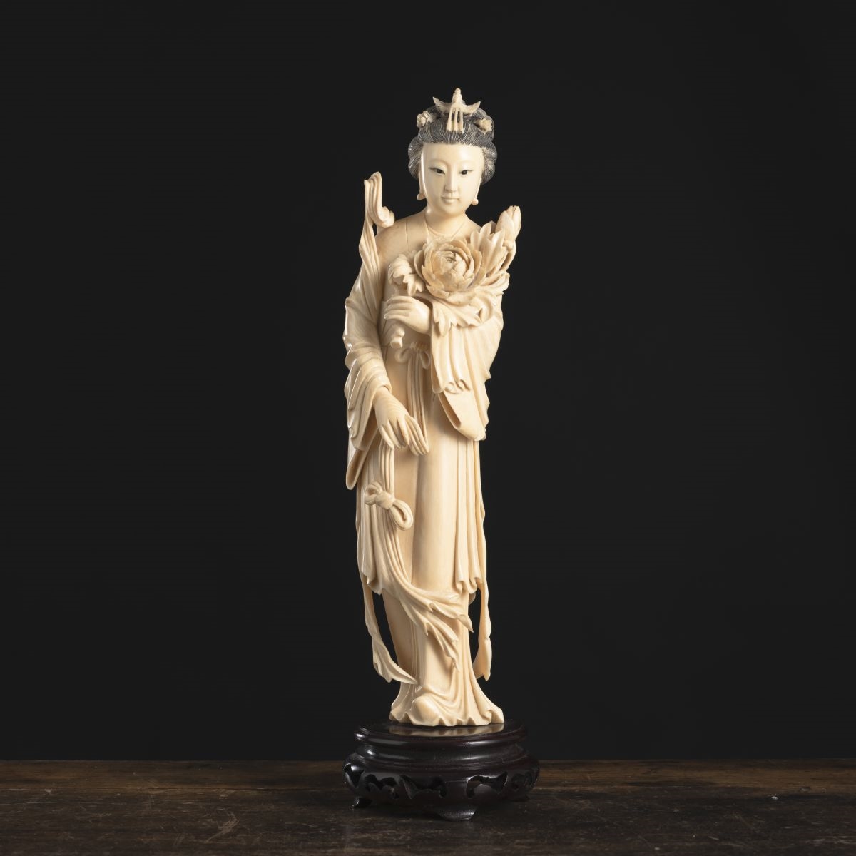 Chinese School | A IVORY CARVED STANDING LADY WITH A PEONY BRANCH ...