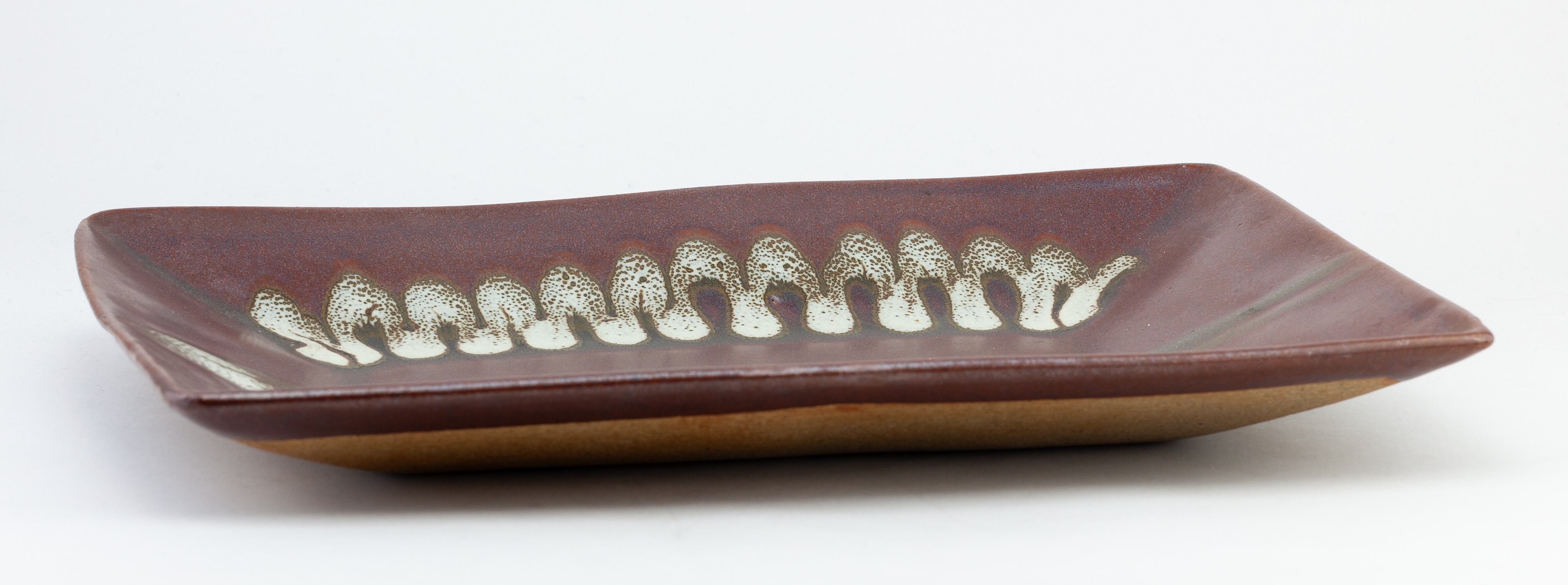 Ray Finch | a large rectangular stoneware dish covered in iron rich glaze with dolomite ...