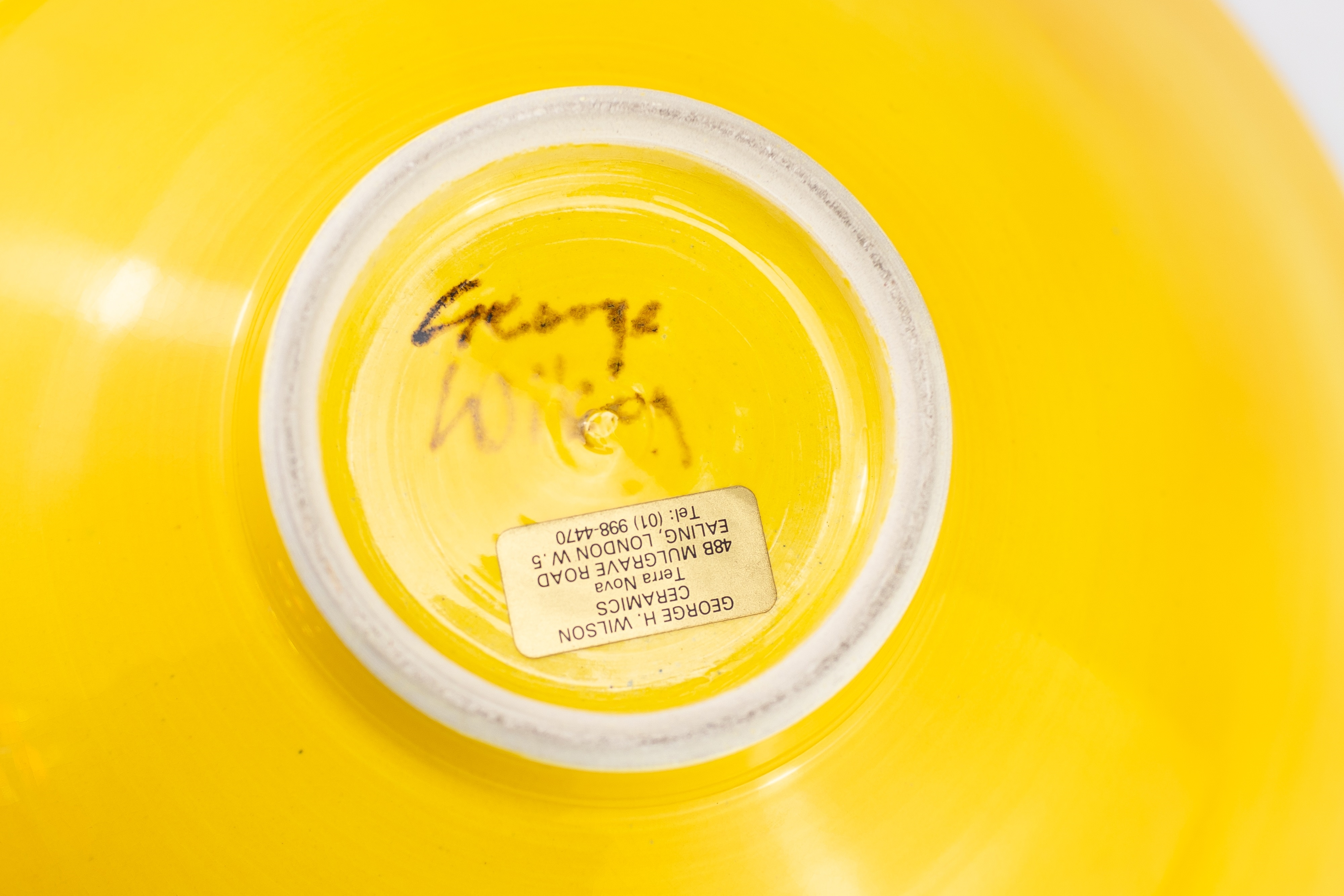 George Wilson | a large stoneware bowl covered in bright yellow glaze ...