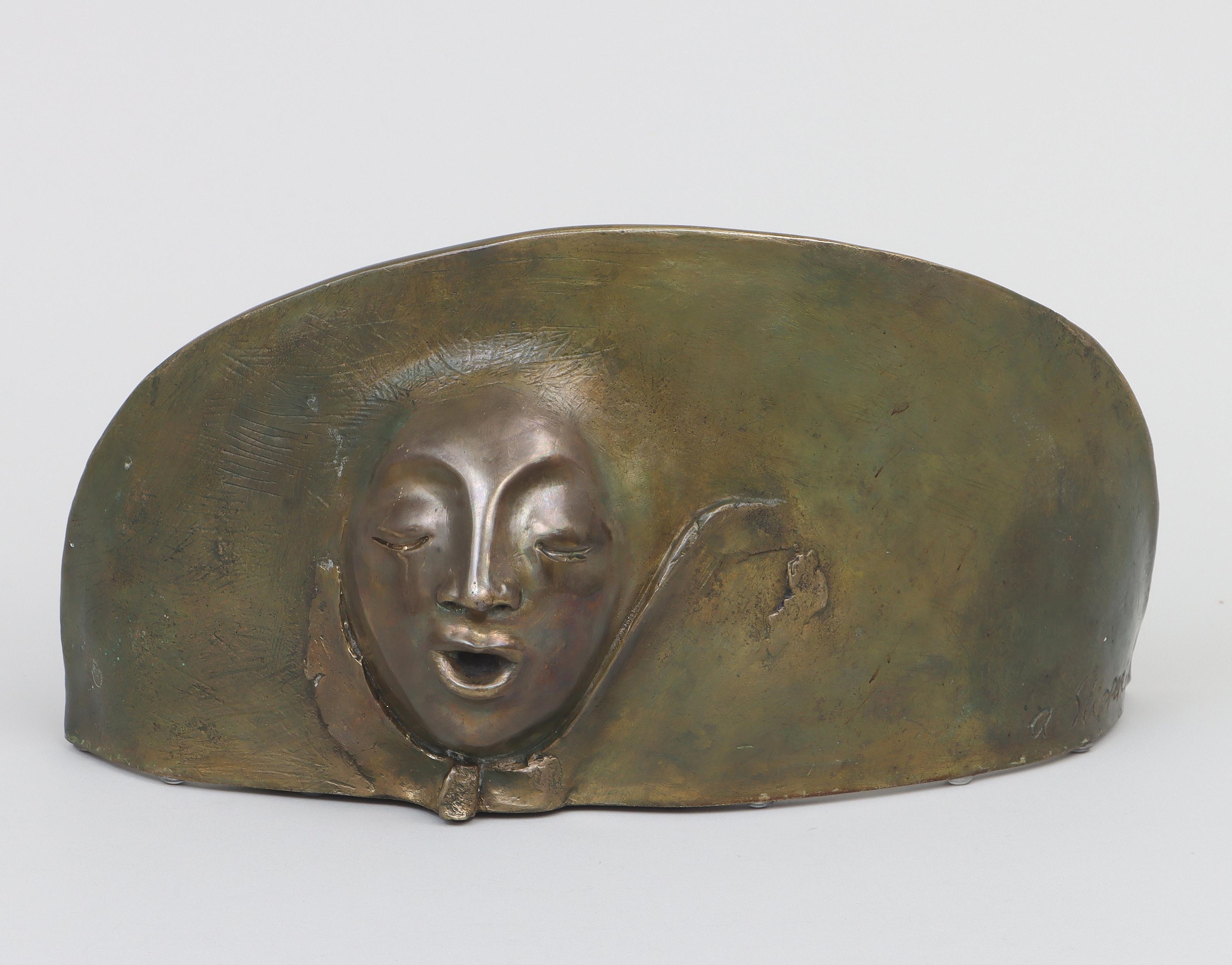 Anne Marie Slipper | bronze sculpture with faces on standing curved ...
