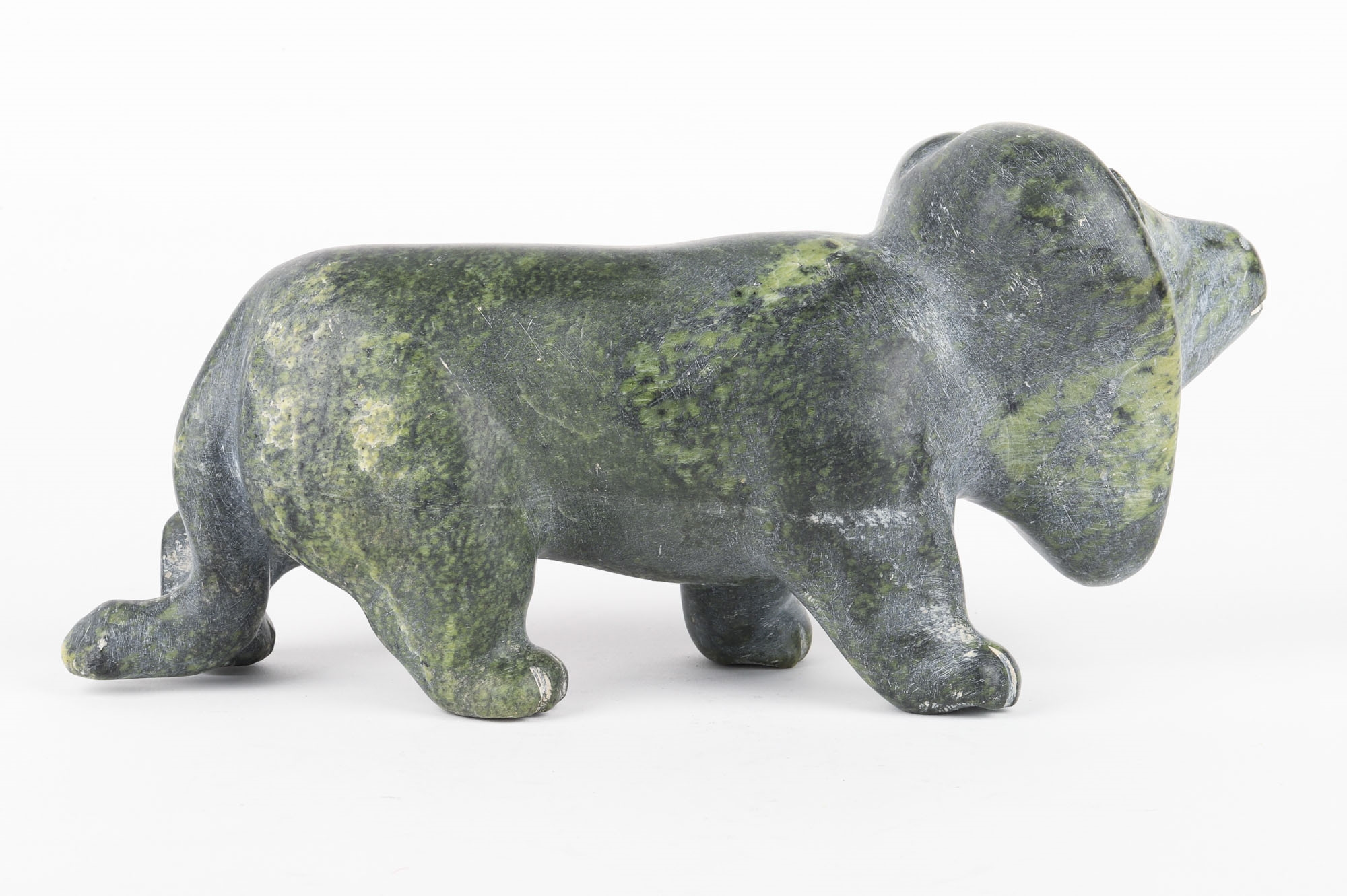 Kiawak Ashoona | 1960. A rare Inuit sculpture of a striding lion carved ...