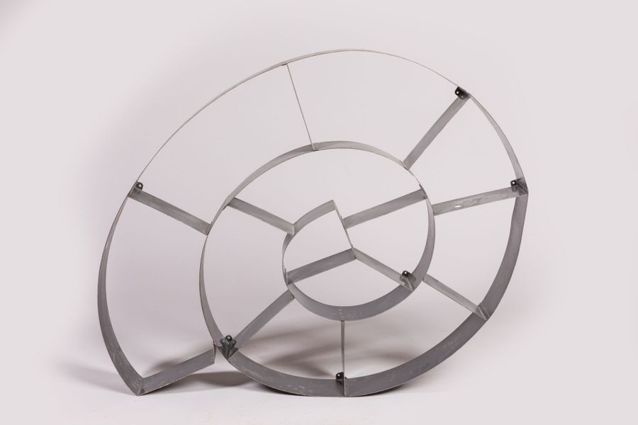 Ron Arad | Patinated metal snail-shaped wall bookcase (1980) | MutualArt