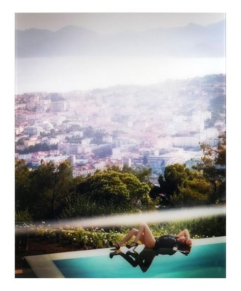 David Drebin | of a female figure by the pool with city in the ...