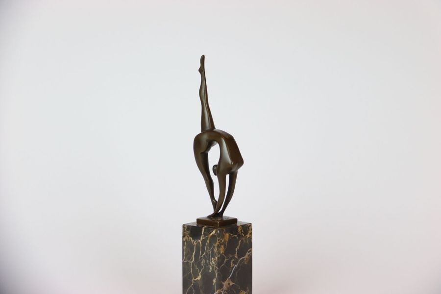 Milo Martin | Bronze sculpture of a stylized woman in an acrobatic ...
