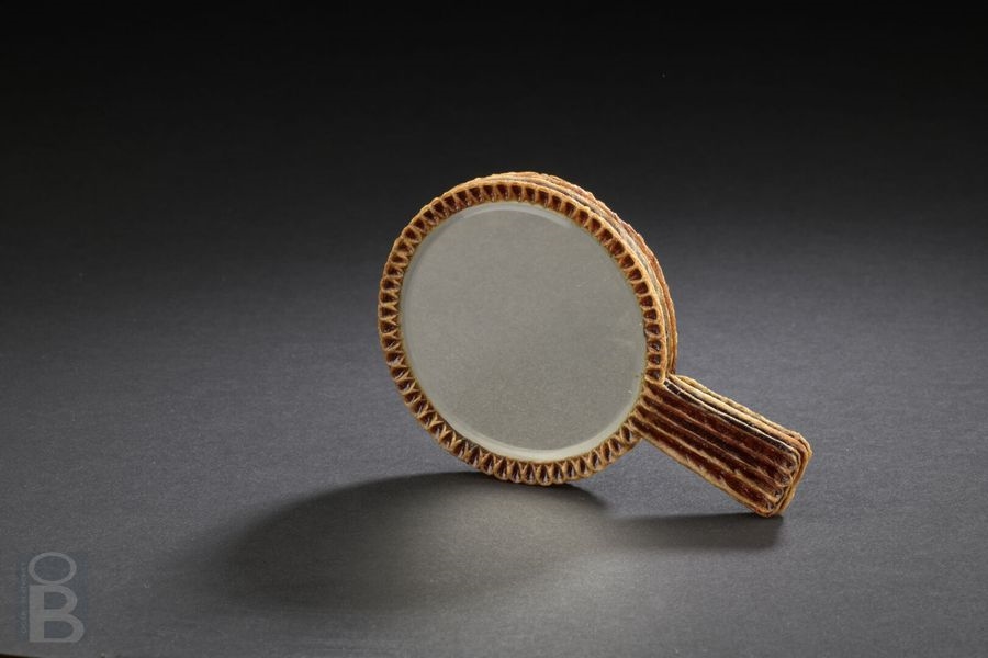 Line Vautrin | Circular hand face in a red-tinted talossel surround and ...