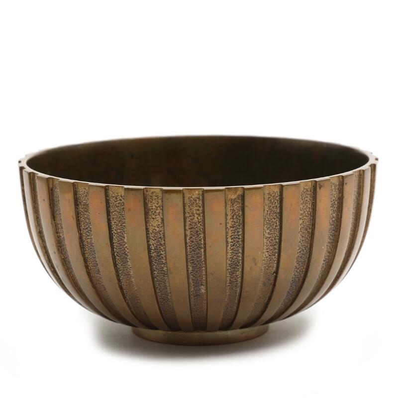 Tinos | A circular patinated bronze bowl, cast with vertical flutings ...