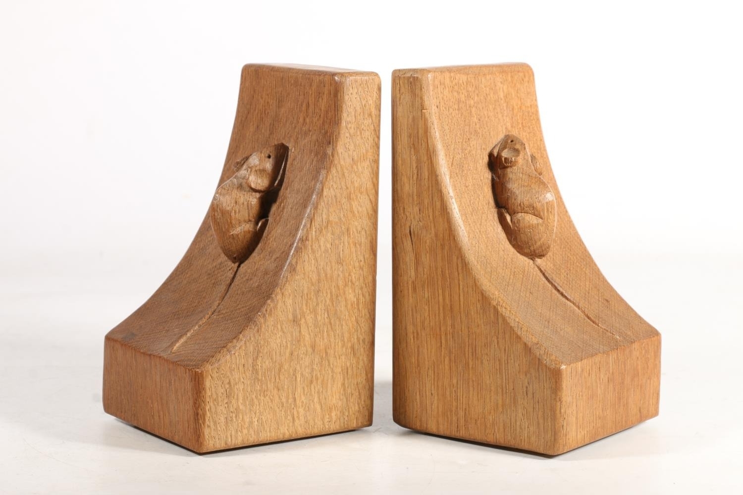Robert Thompson | a pair of sloping Yorkshire Oak bookends carved with ...