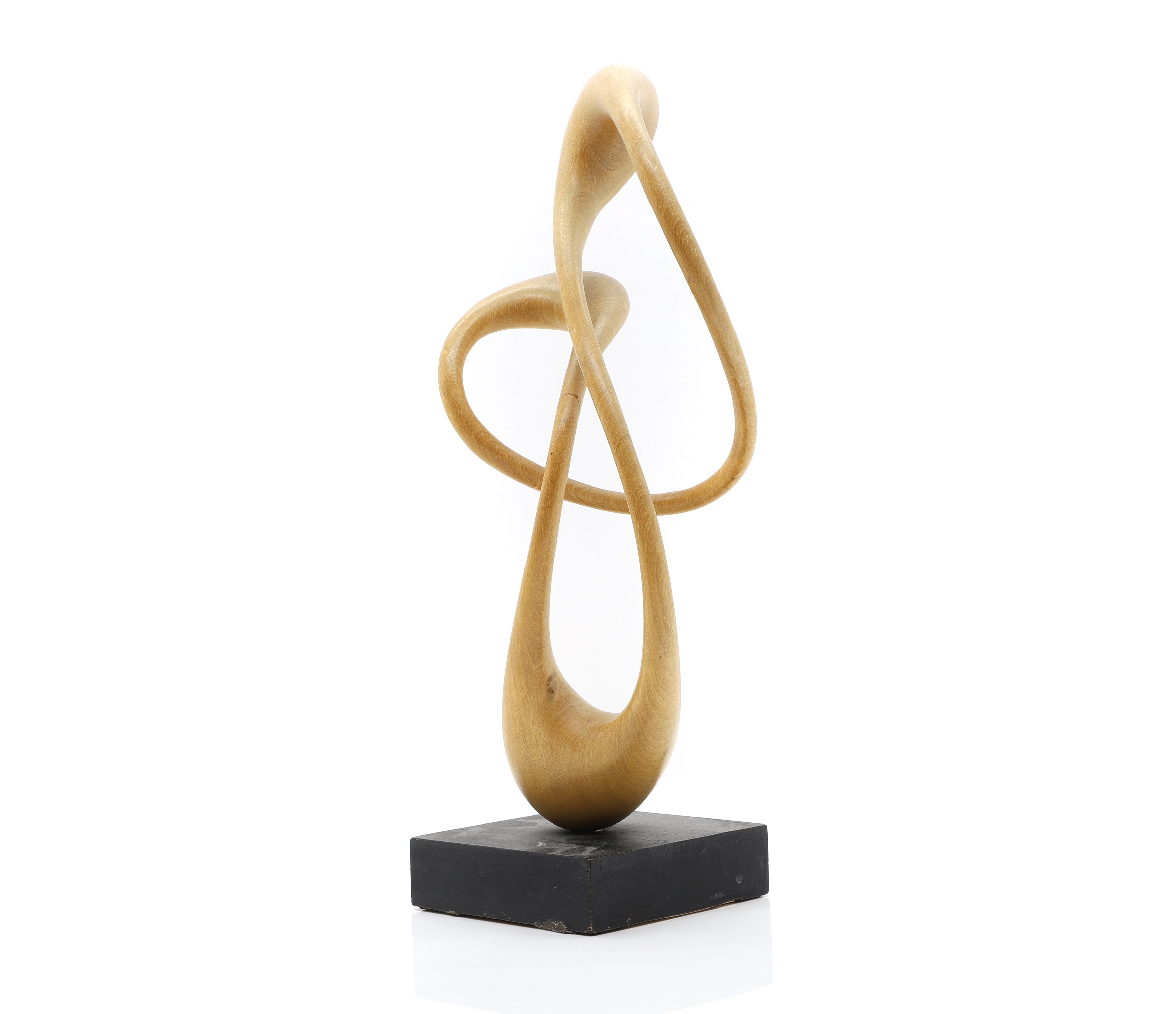 John Spielman | a carved wood ‘Loop’ sculpture raised on a wood plinth ...