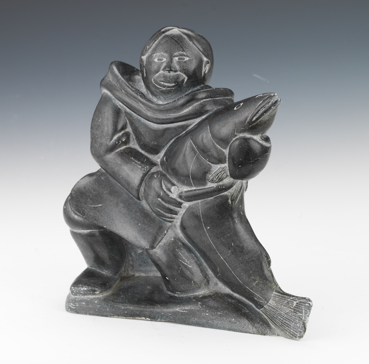 Lui Escoto | Traditional large heavy Inuit carved stone of a man with a ...