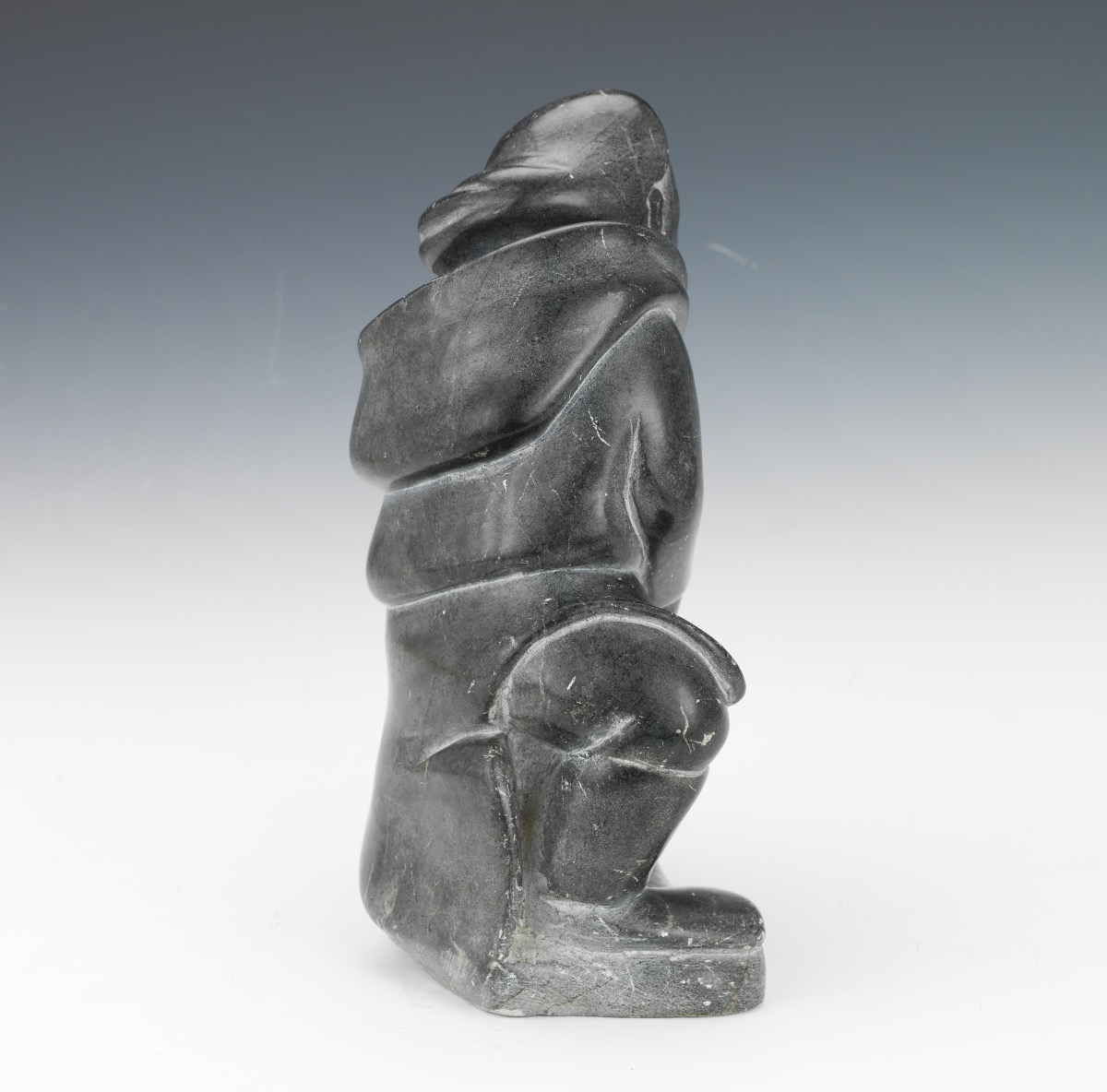 Lui Escoto | Traditional large heavy Inuit carved stone of a man with a ...