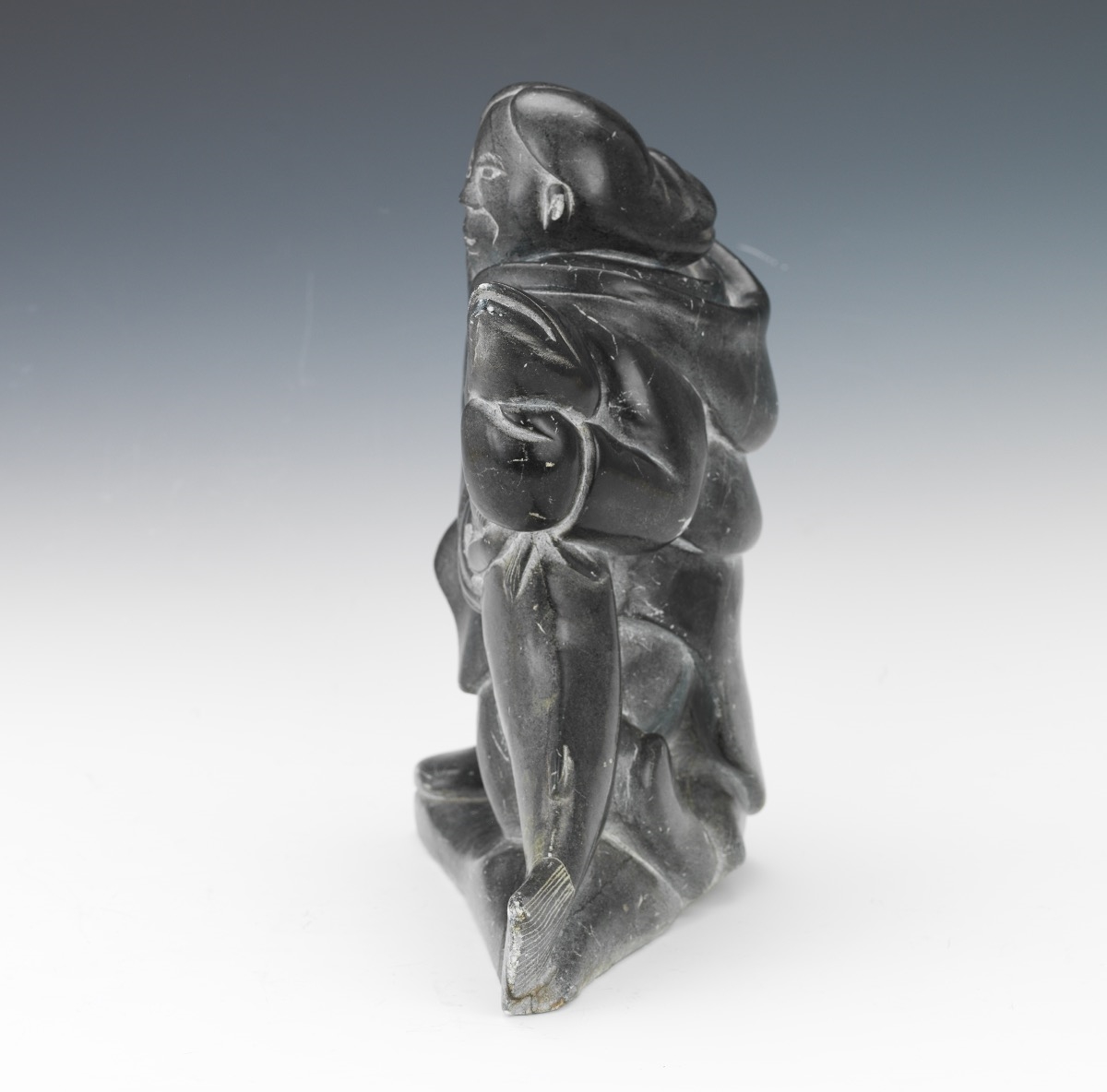 Lui Escoto | Traditional large heavy Inuit carved stone of a man with a ...