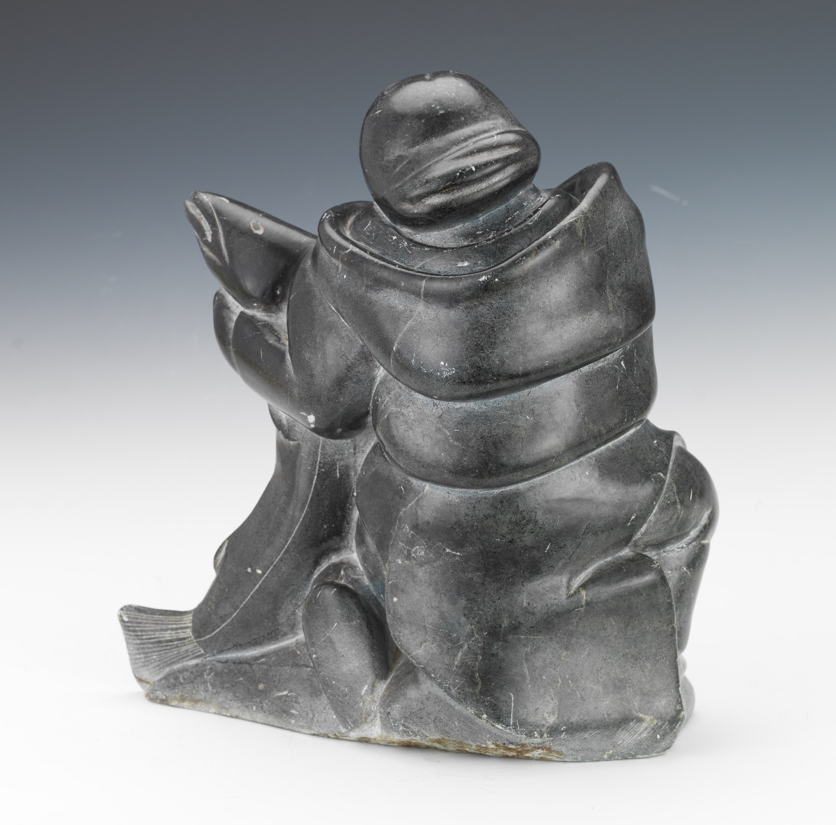 Lui Escoto | Traditional large heavy Inuit carved stone of a man with a ...
