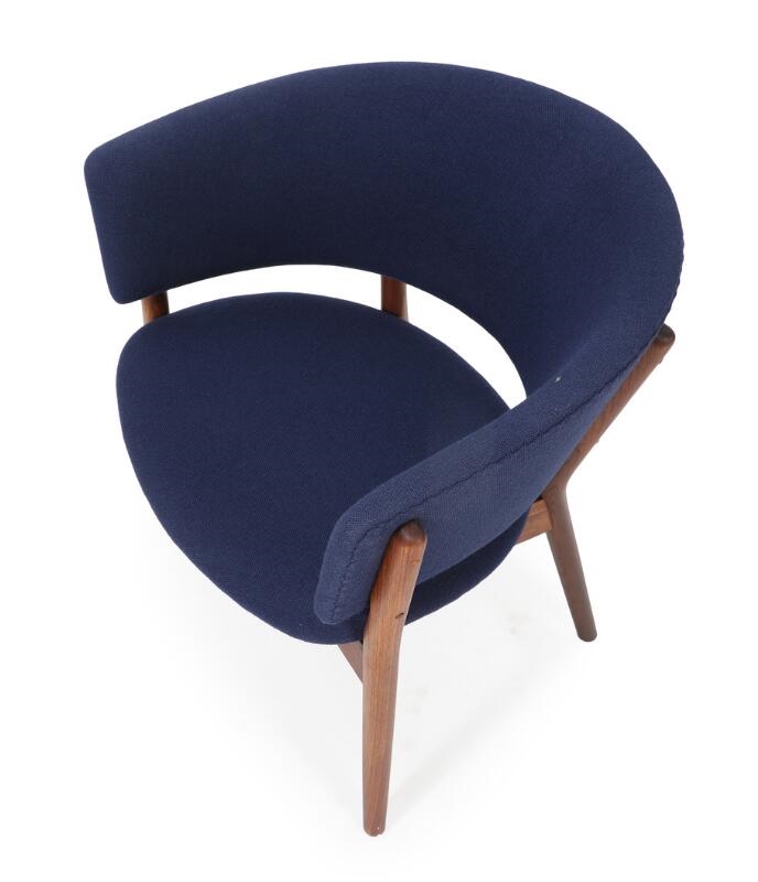 Nanna Ditzel | An oiled walnut easy chair upholstered with blue ...