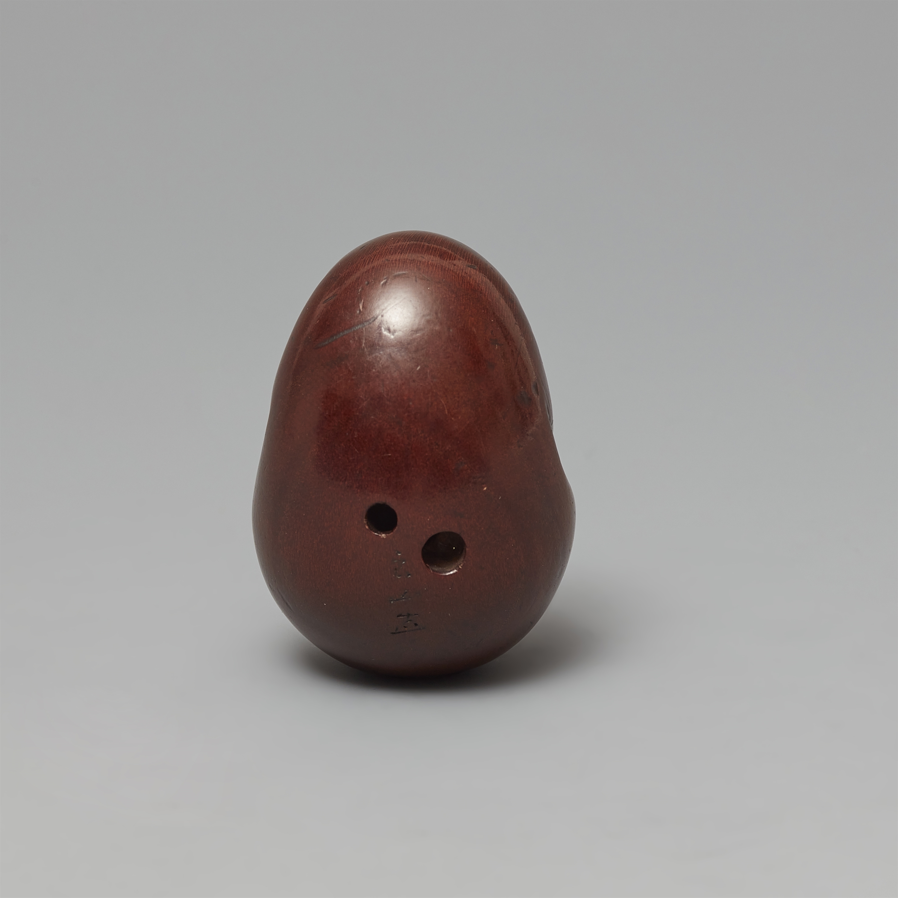 Ryozan | A boxwood netsuke of a Daruma doll | MutualArt