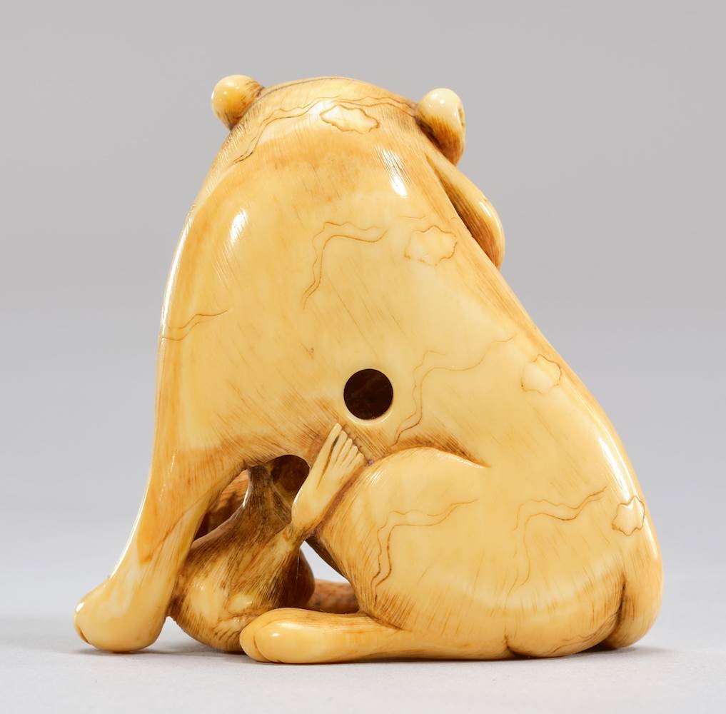 Japanese School, 19th Century | A NETSUKE OF A TIGER WITH A LITTLE ...