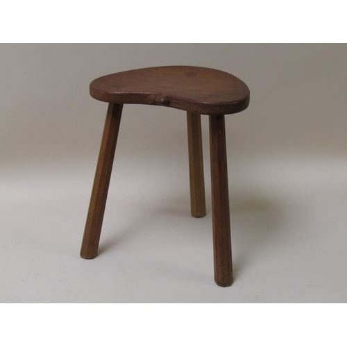 Robert Thompson | A Mouseman oak stool of heart shaped form supported ...