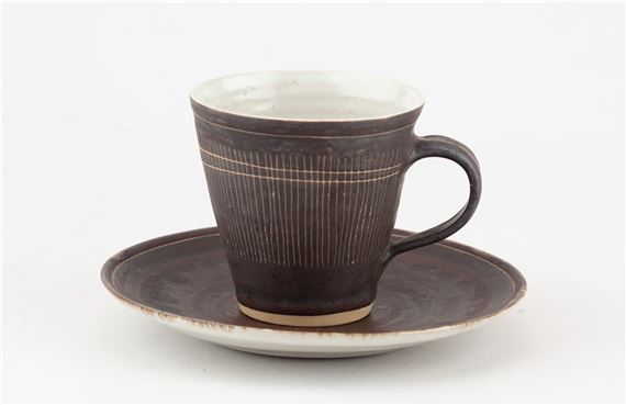 Lucie Rie | LUCIE RIE (1902-1995); a stoneware cup and saucer partially ...