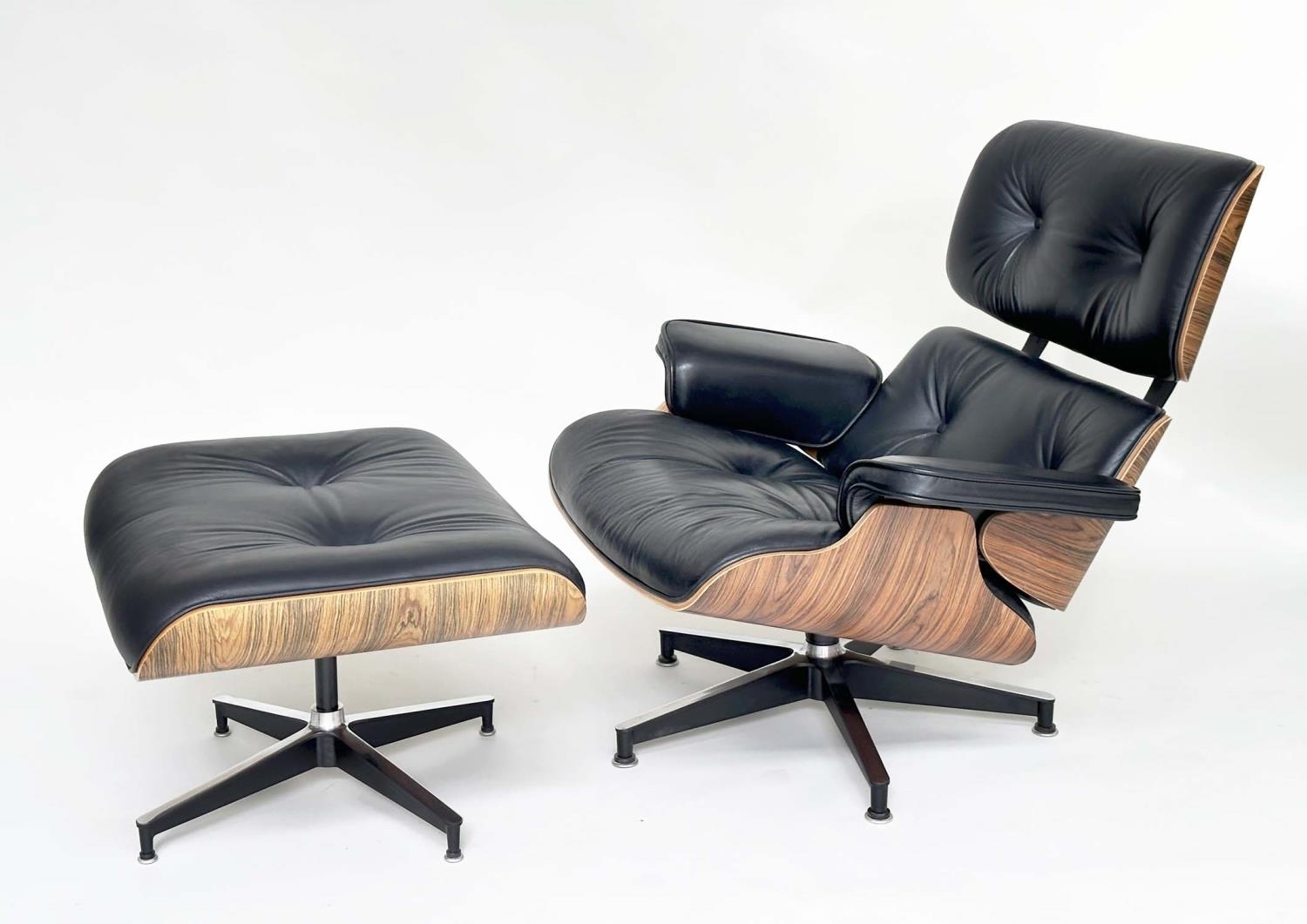 Charles & Ray Eames | black leather and rosewood with companion ottoman ...