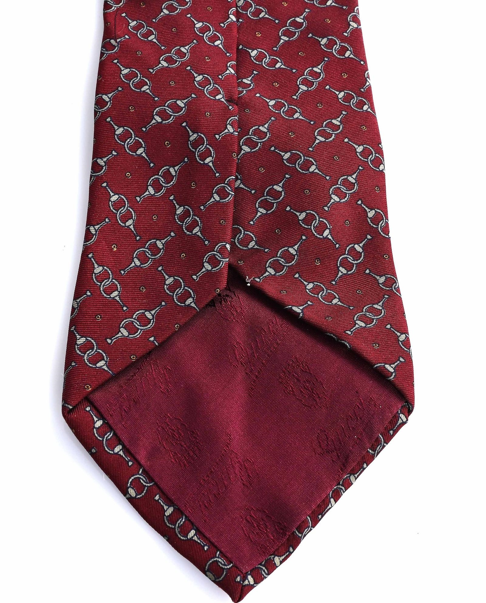 Yves Saint Laurent | Collection of three ties; a Gucci with horse-bit ...