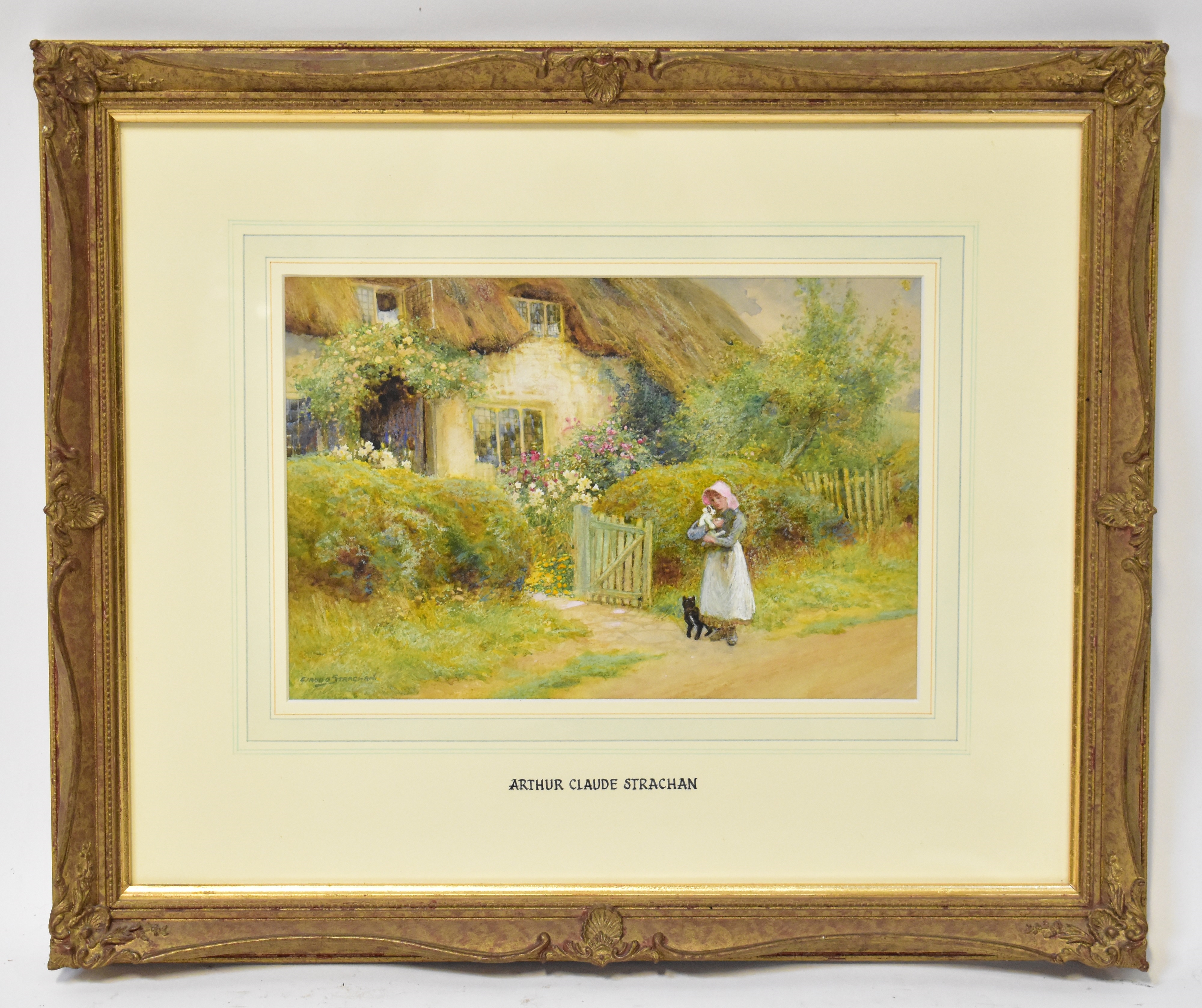 Arthur Claude Strachan | a girl outside a thatched cottage cuddling a ...