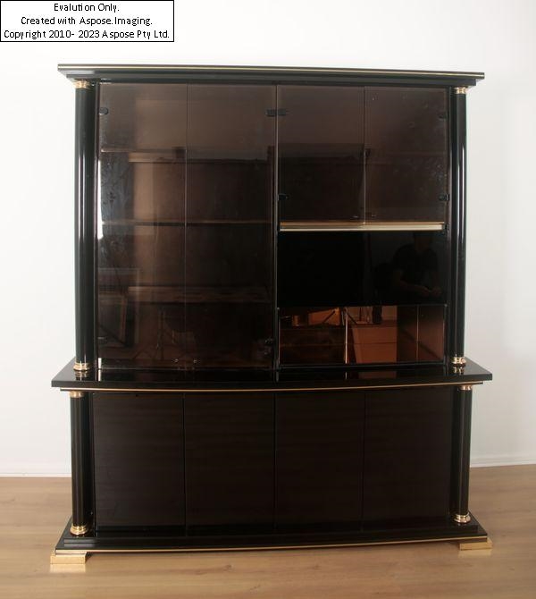Pierre Vandel | A 1980’S BLACK RESIN AND GILT METAL WALL UNIT IN THE ...