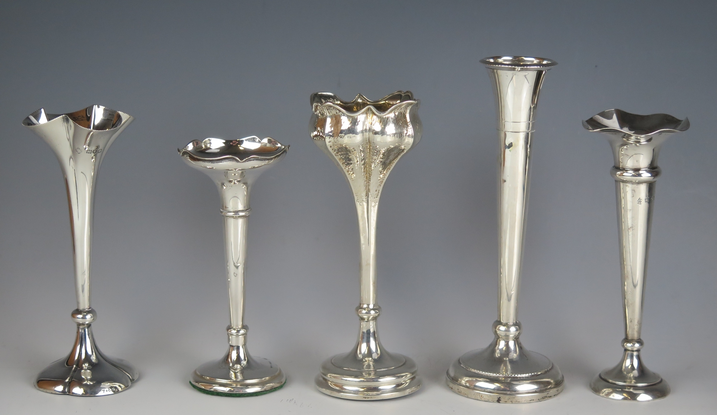 The Stems | A collection of five assorted silver specimen vases | MutualArt