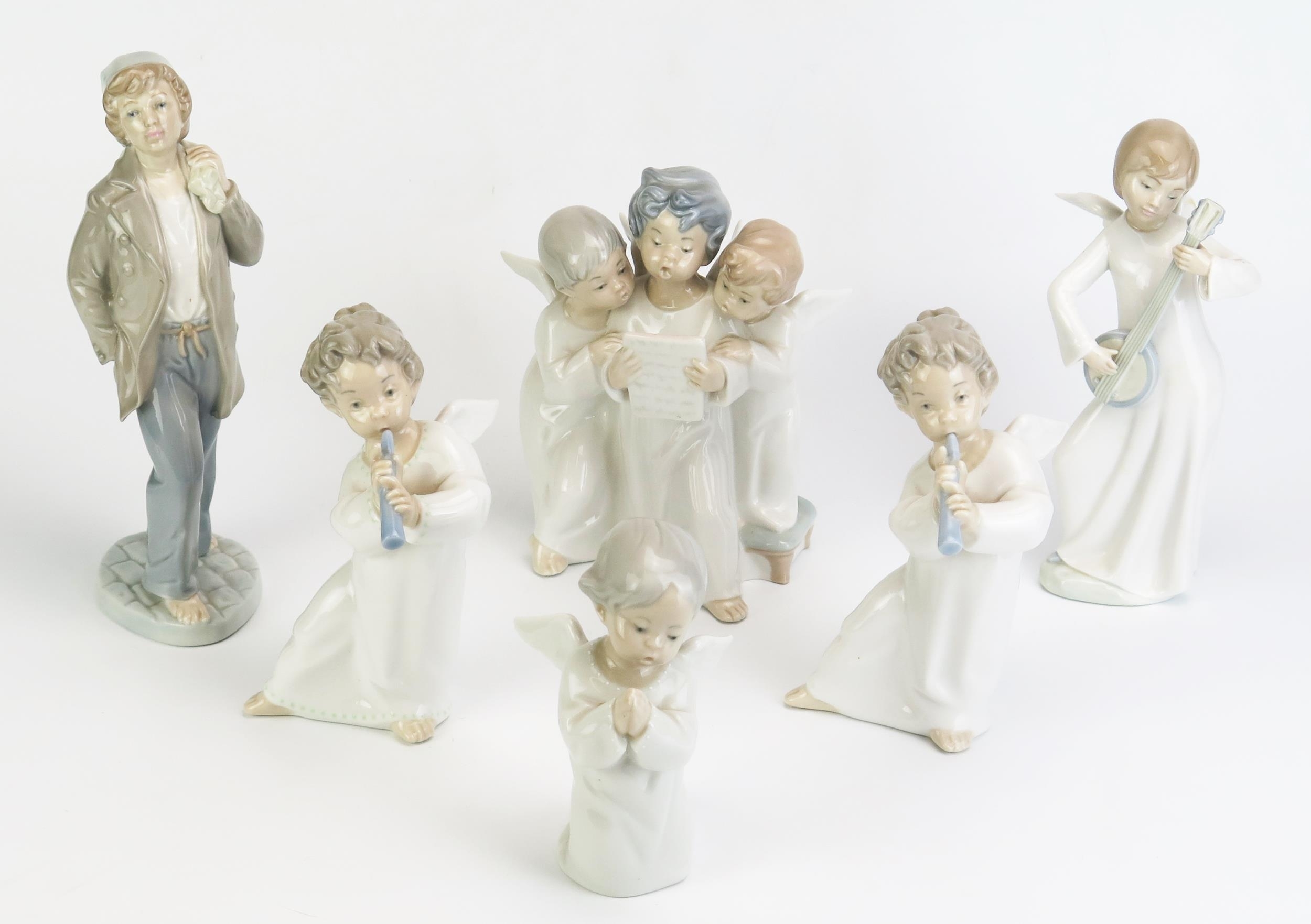 Nao Porcelain | Five Lladro and Nao porcelain figurines including ...