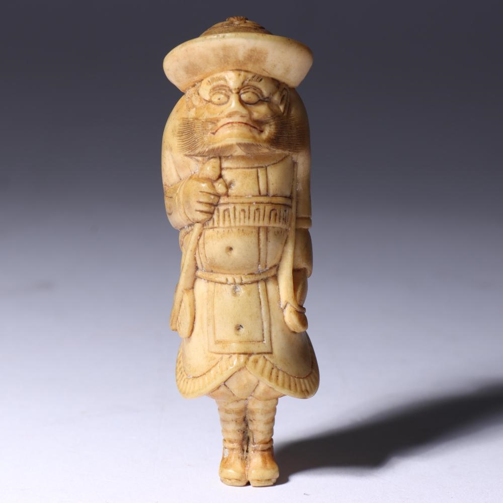 Japanese School | Japanese Edo netsuke; carved staghorn bone figure of ...