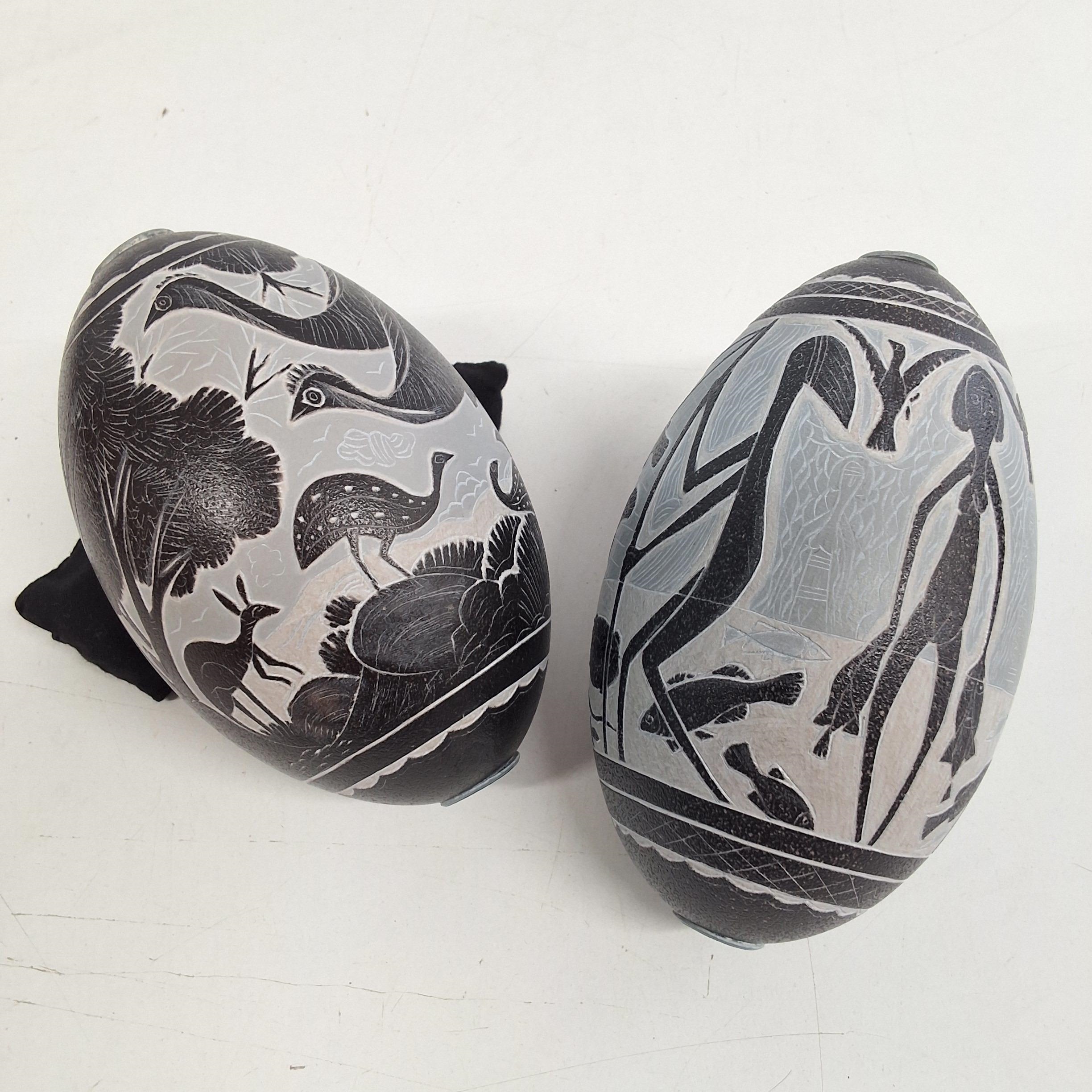 Bluey Roberts | Two carved emu eggs | MutualArt