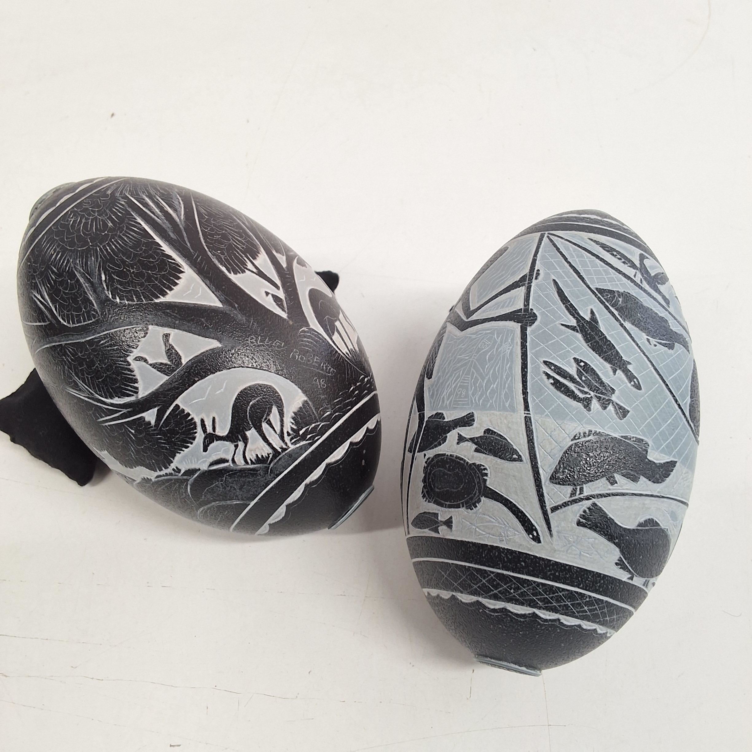 Bluey Roberts | Two carved emu eggs | MutualArt
