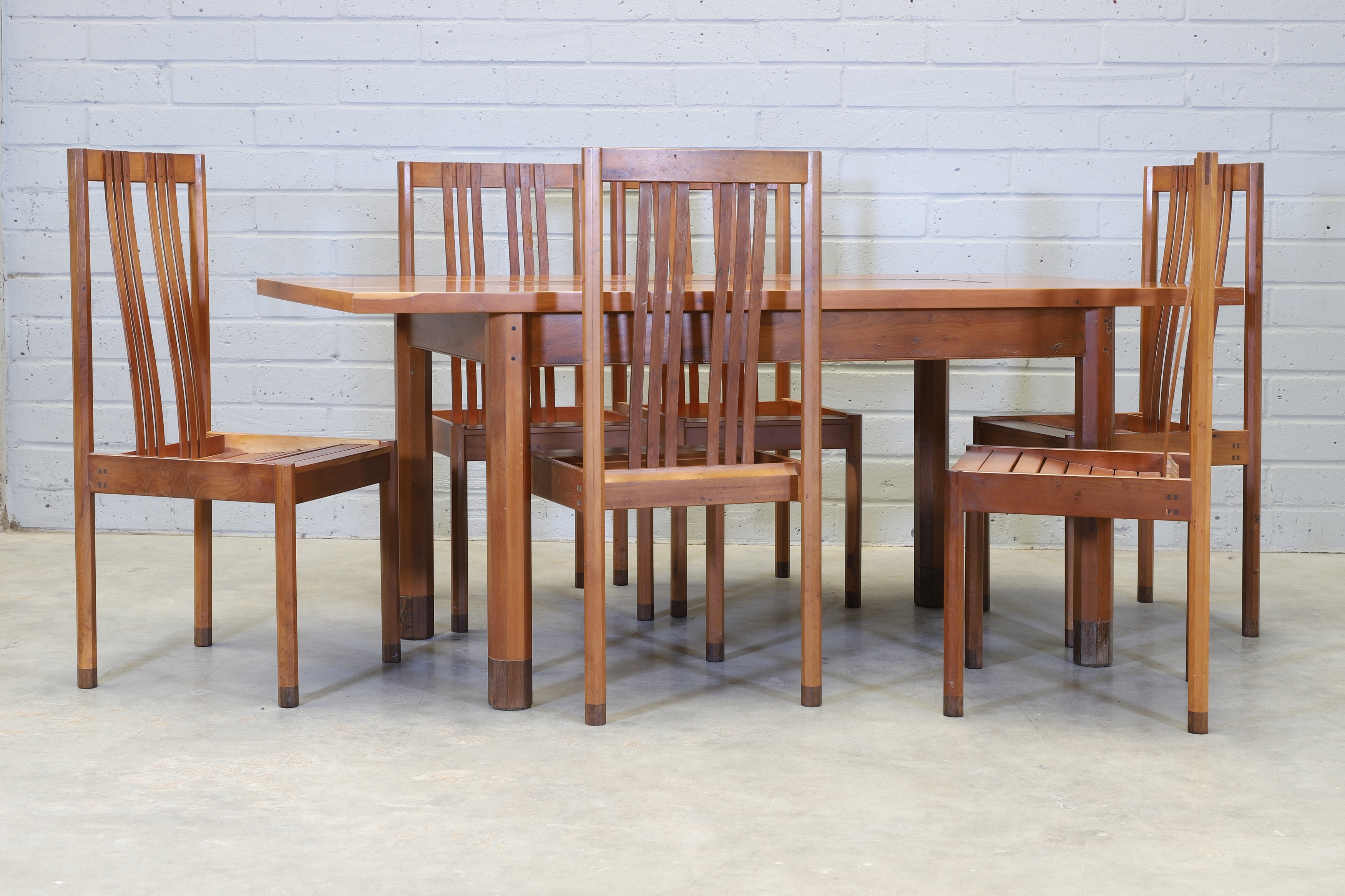 Alan Peters | a yew wood dining suite designed in 1979 comprising ...