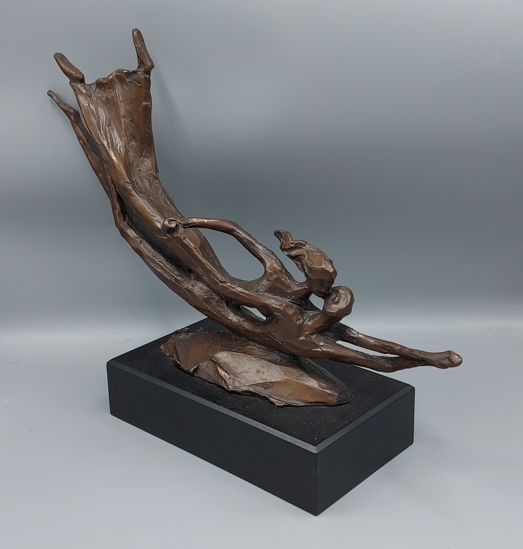 Bernard Kim | A patinated bronze model of an abstract couple upon a ...