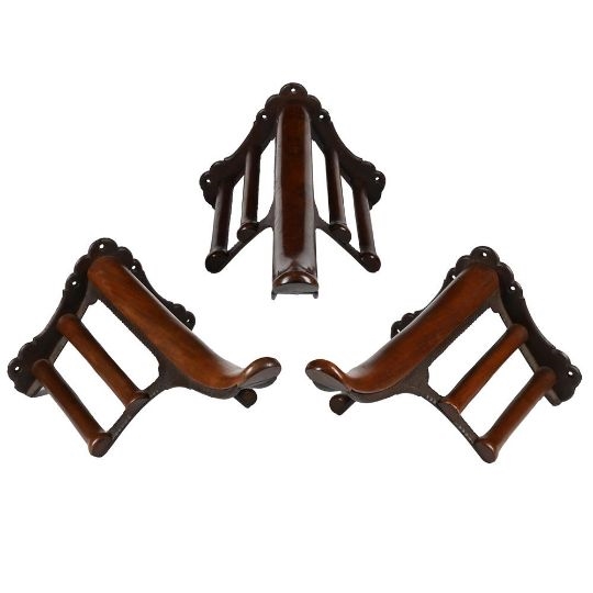 Musgrave | A GROUP OF THREE VICTORIAN CAST IRON AND WALNUT WALL SADDLE ...