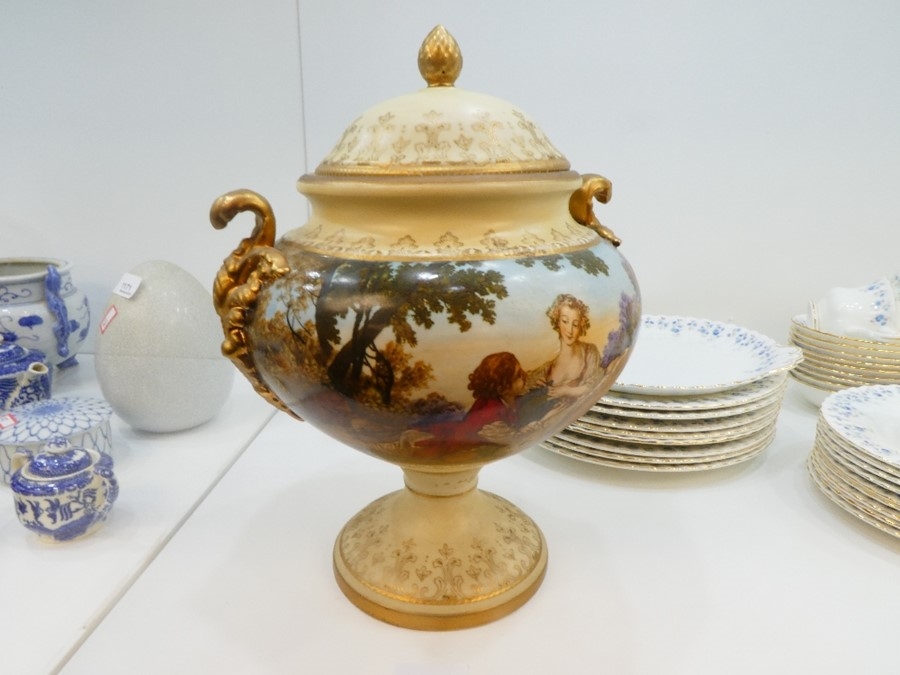 F. Boucher | A Sevres style double handled lidded urn, decorated with a ...