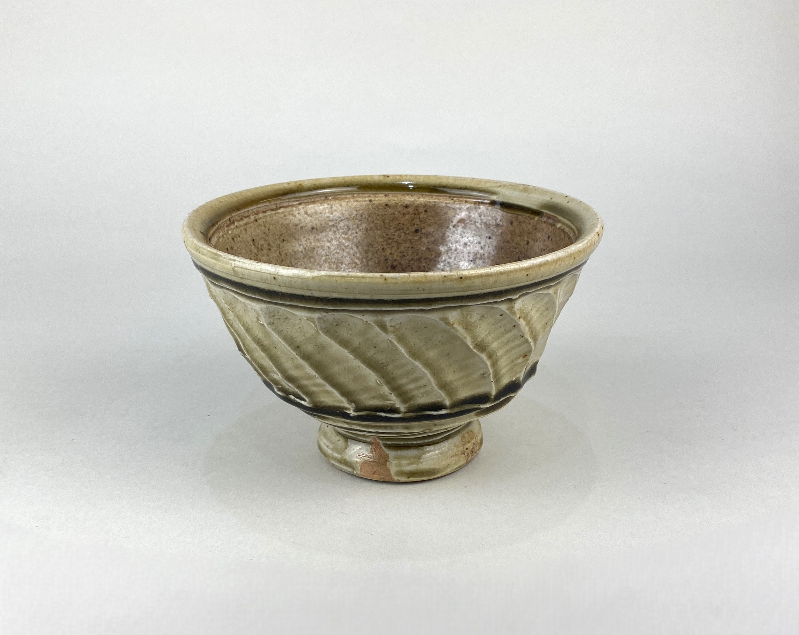 Patrick Sargent | a studio pottery fluted bowl with green glaze | MutualArt