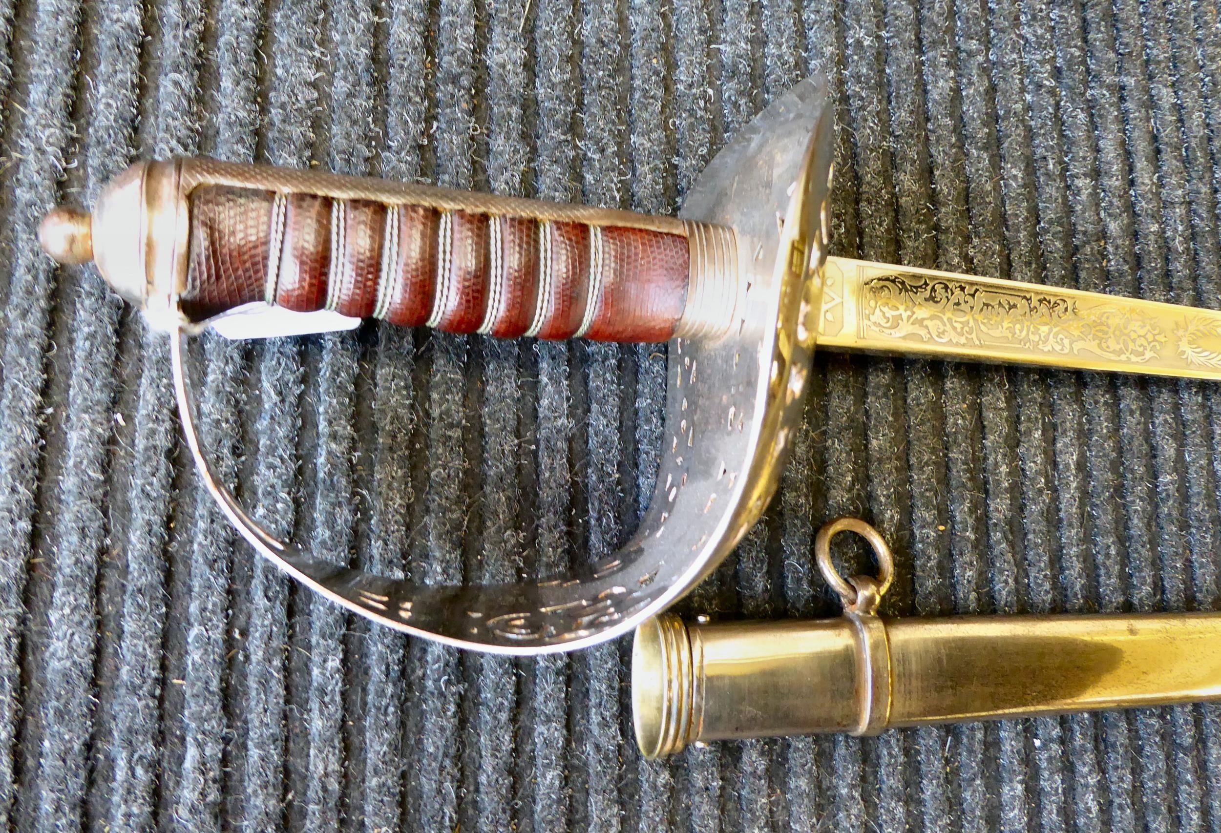 An Edwardian | An Edwardian VII dress sword with a pierced and silvered ...
