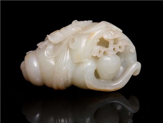 Chinese School, 18th Century | A carved jade Buddhist emblem | MutualArt