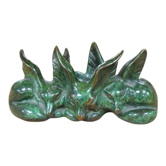 Raoh Schorr | A green patinated bronze group of three seated foxes ...