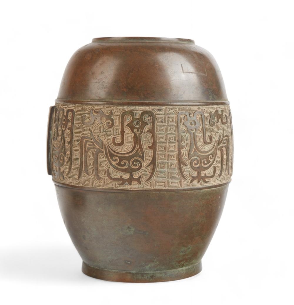 Frederick | Two East Asian bronze vases with archaistic zoomorphic ...