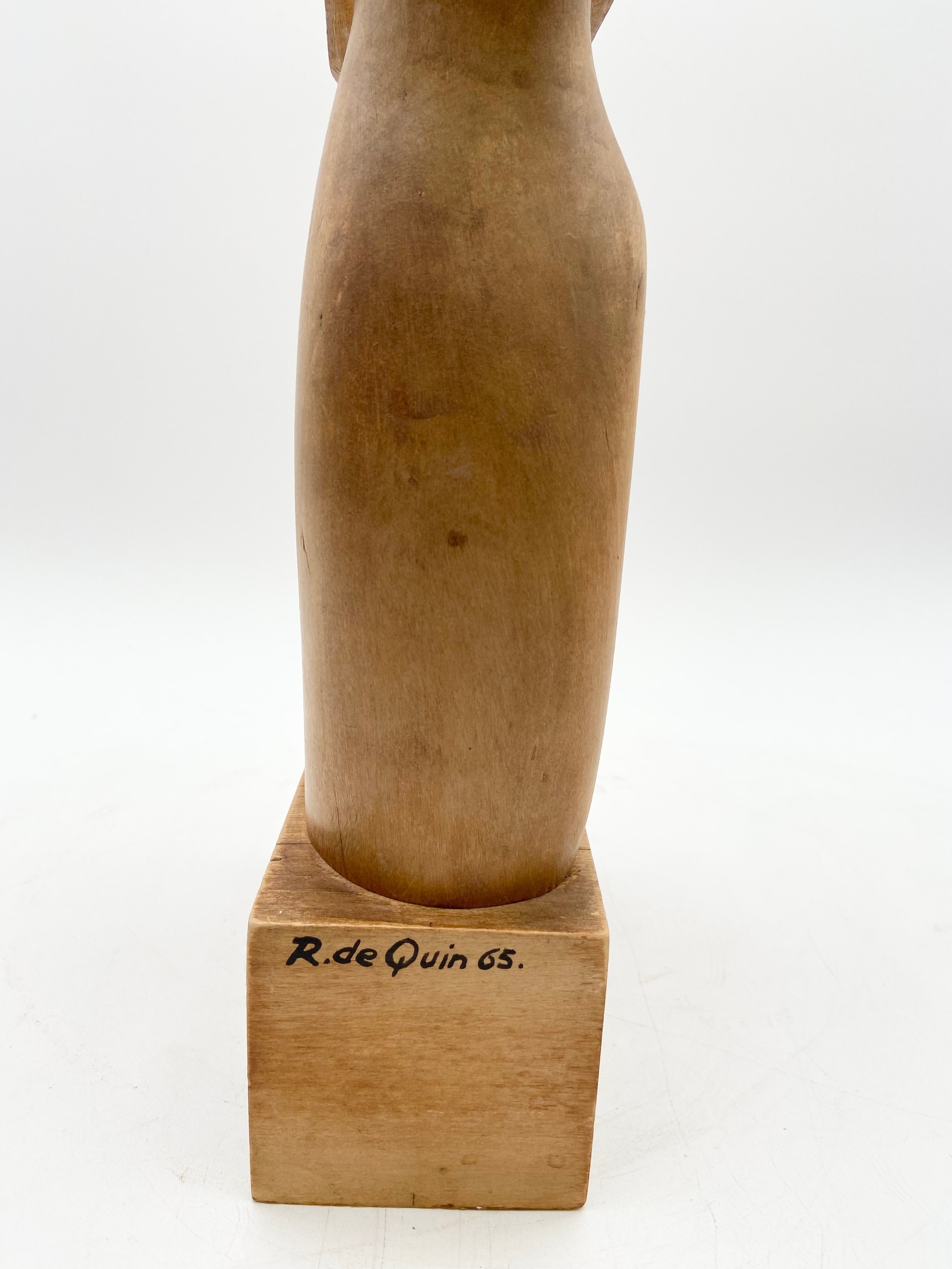Robert De Quin | A mid-century carved teak abstract figural sculpture on a plinth base by Robert ...